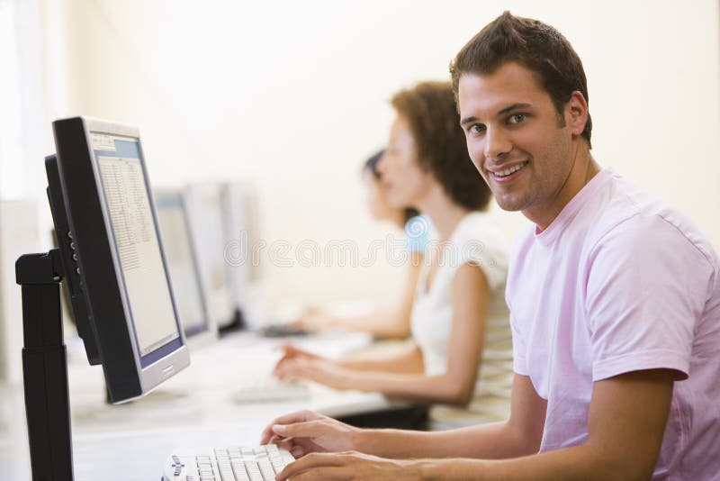 Three People Sitting in Computer Room Typing Stock Photo - Image of ...