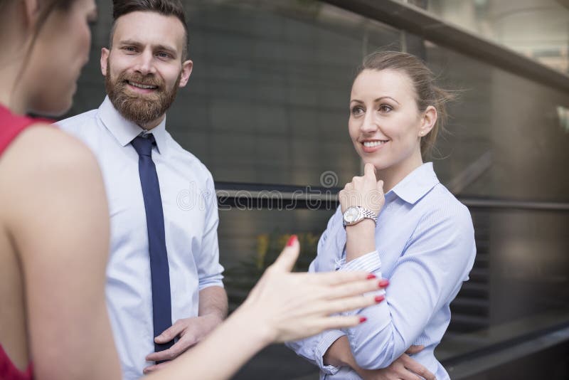 Three People Talking Outdoors Stock Image - Image of formalwear ...
