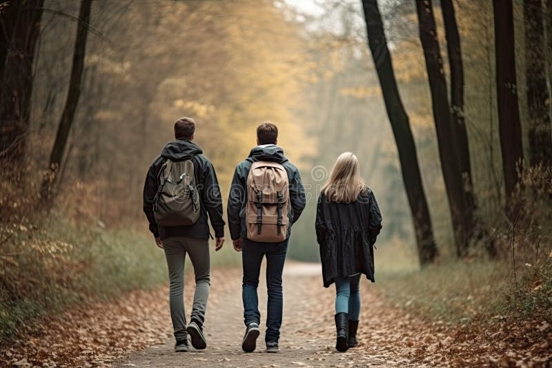Three People Walking Down a Path in the Woods Stock Image - Image of ...