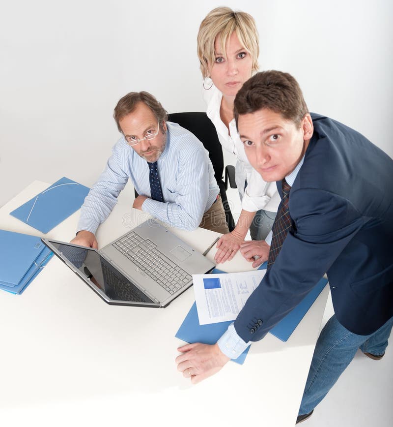 Three people at work stock image. Image of concentration - 33912657