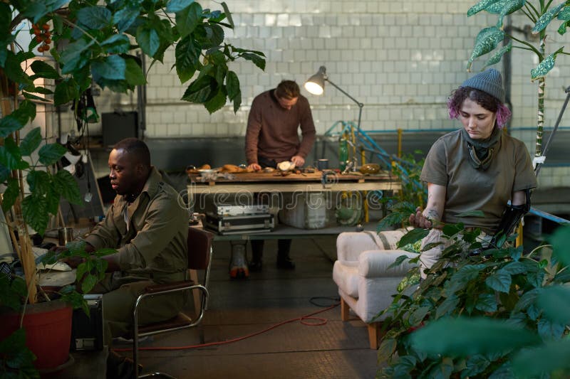 Three People Working in Post-apocalyptic Building Stock Image - Image ...