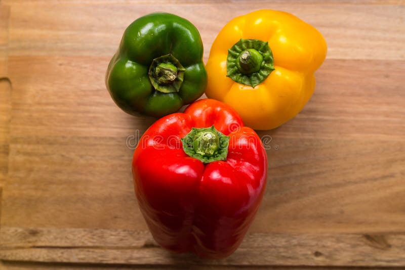 Three peppers stock image. Image of peppers, table, vegetarian - 71672639