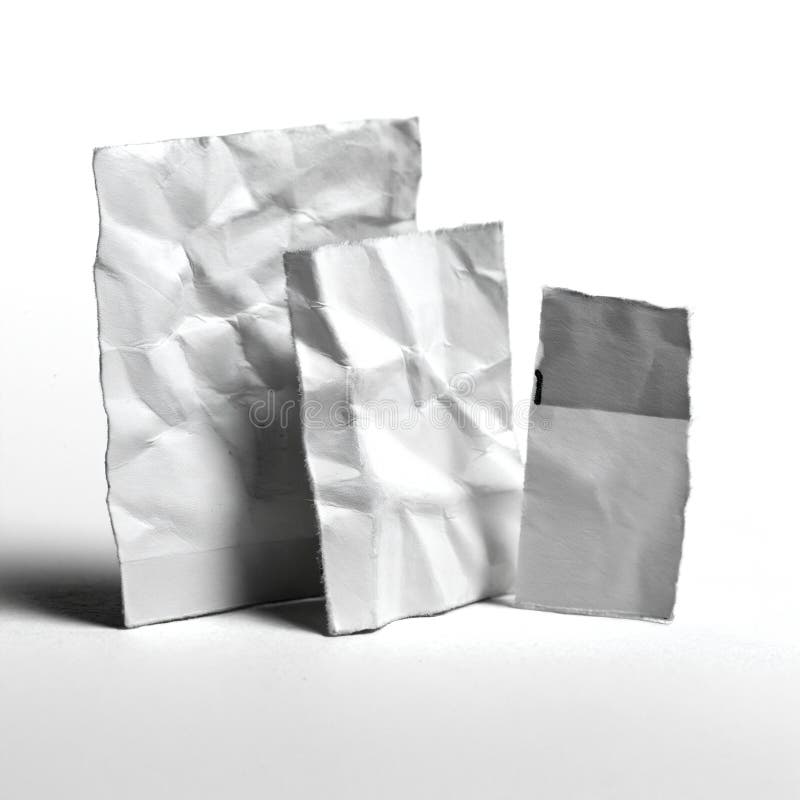 Three Pieces of Crumpled White Paper Standing on White Surface Stock ...