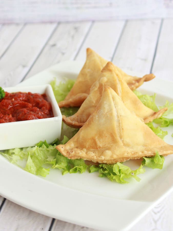 Pieces of Fried Samosa with a Dipping Sauce on the Side Stock Photo ...