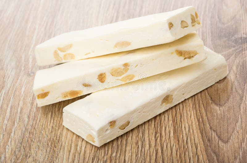 Three Pieces of Nougat with Nuts on Table Stock Image - Image of three ...