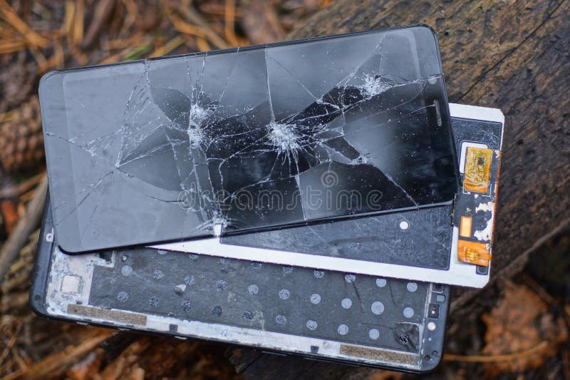 Three Pieces of an Old Disassembled Smartphone with a Broken Black ...