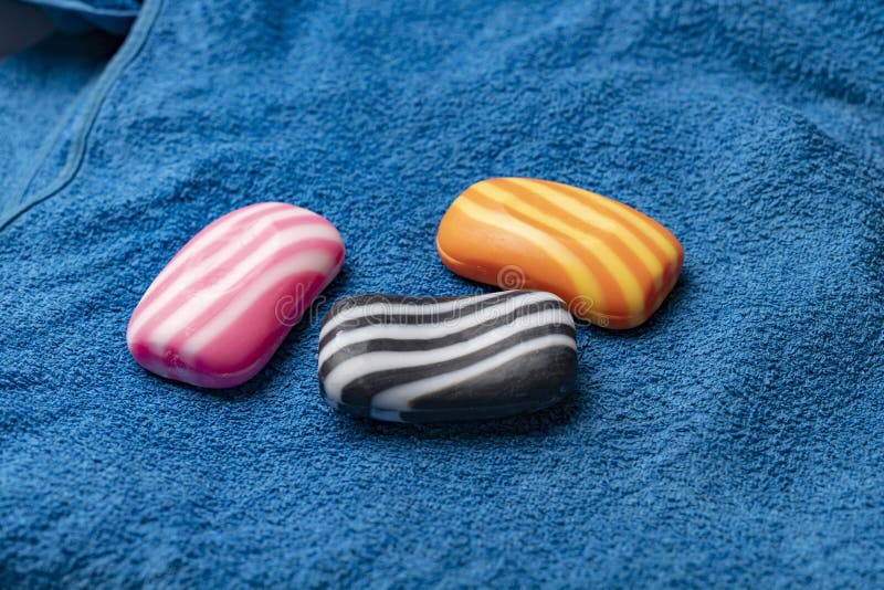 The Three Pieces of Striped Soap Bars on the Towel Textile Texture, Spa ...