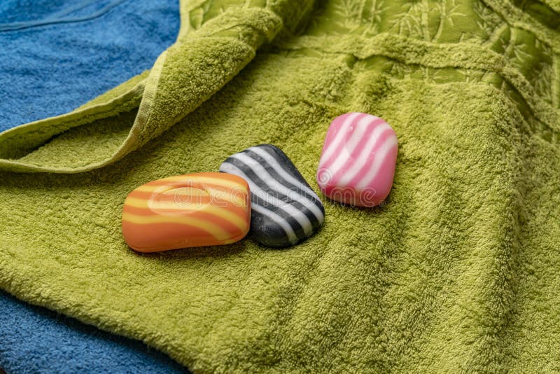 The Three Pieces of Striped Soap Bars on the Towel Textile Texture, Spa ...
