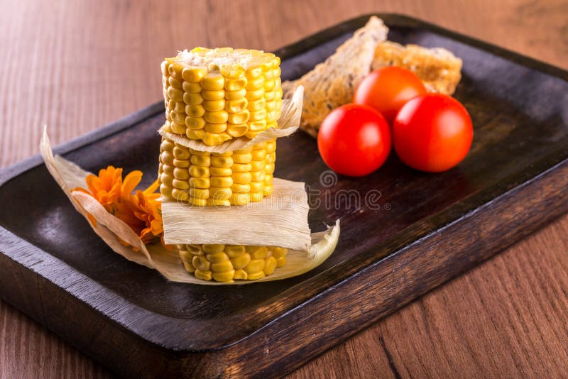 Three Pieces of Sweet Corn with Bread and Tomatoes Stock Photo - Image ...