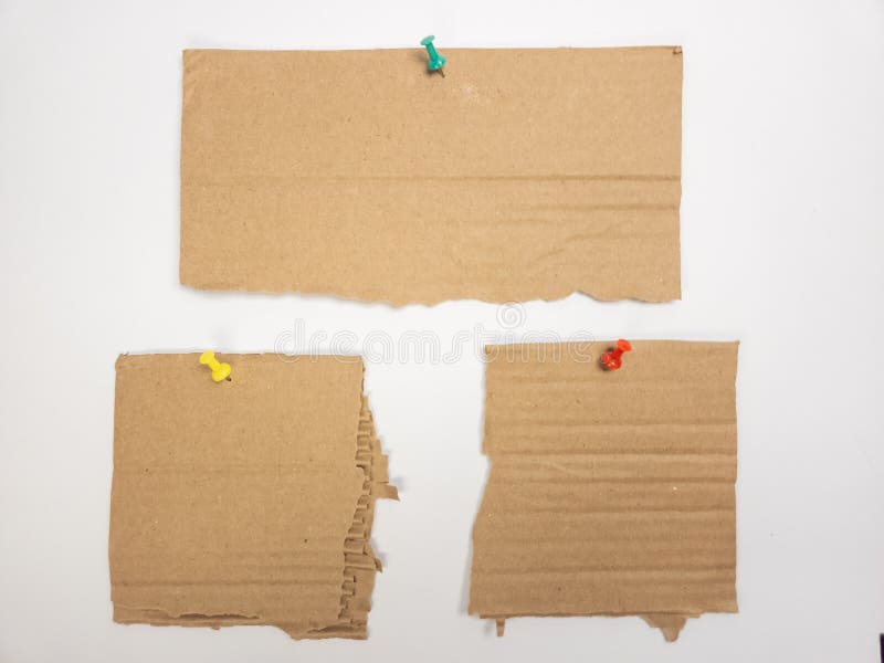 Three Pieces of Torn Cardboard with Colorful Push Pins on White ...