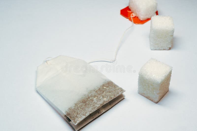 Three Pieces of White Sugar and Tea Bag on White Background, Tea and ...