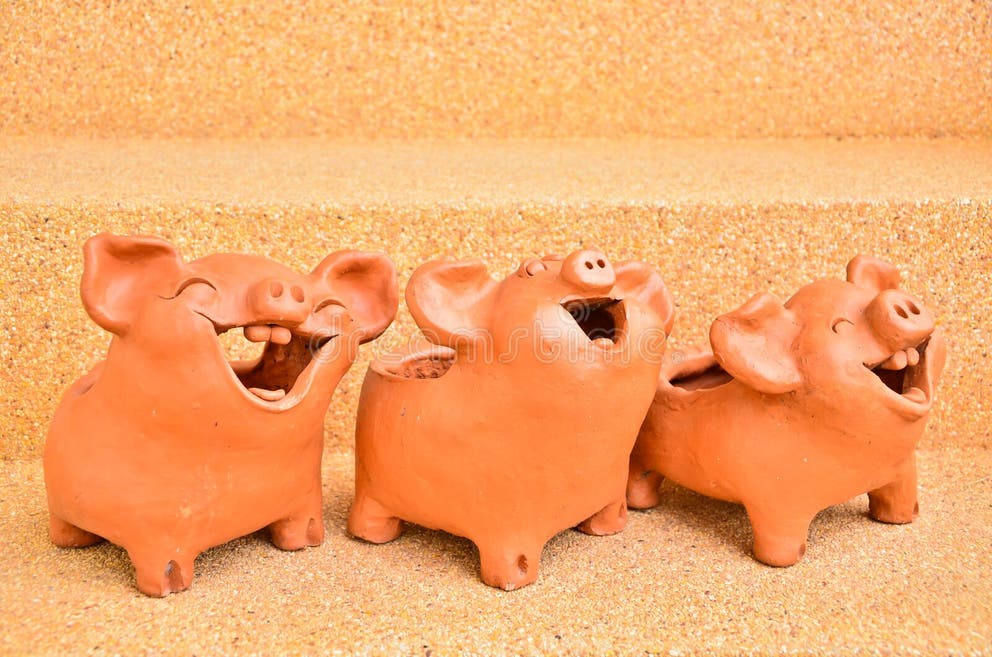 Three Pig statues laugh stock image. Image of budget - 28425647