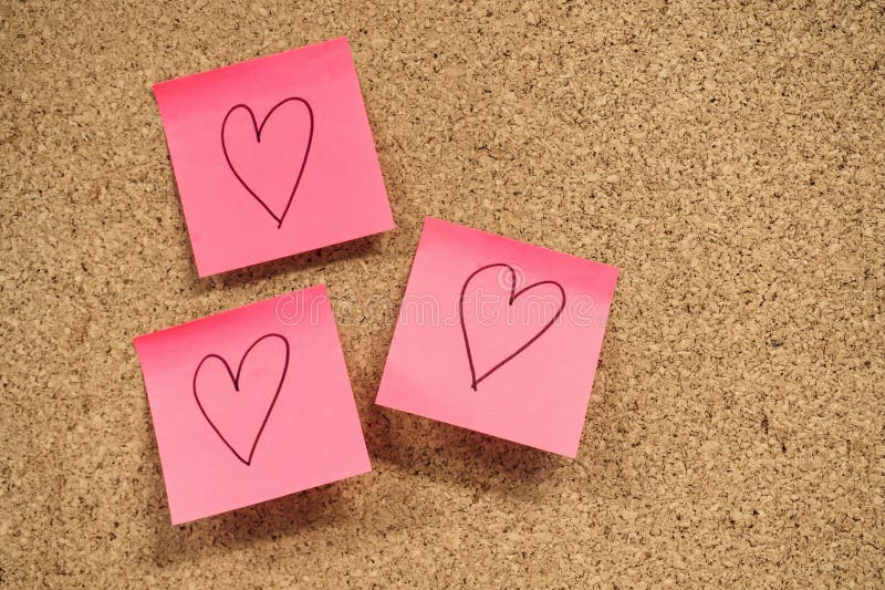 Three Pink Sticky Notes with Hand-Drawn Hearts on Corkboard Stock Photo ...