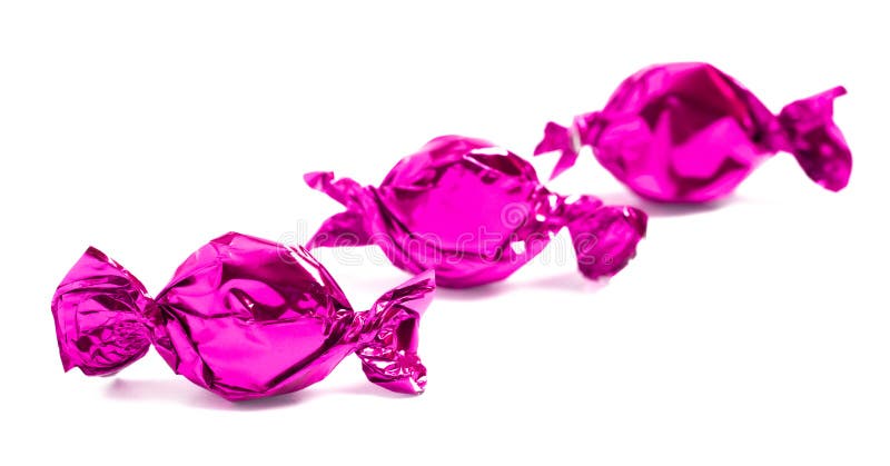 Three Pink Wrapped Candy on a White Background Stock Photo - Image of ...
