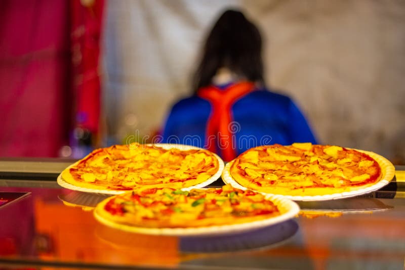 Three Pizzas on the Counter Stock Image - Image of platter, pepperoni ...