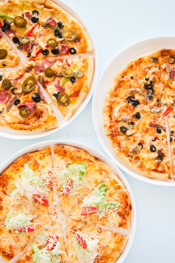 Three Pizzas with Different Fillings on a Table. Stock Photo - Image of ...