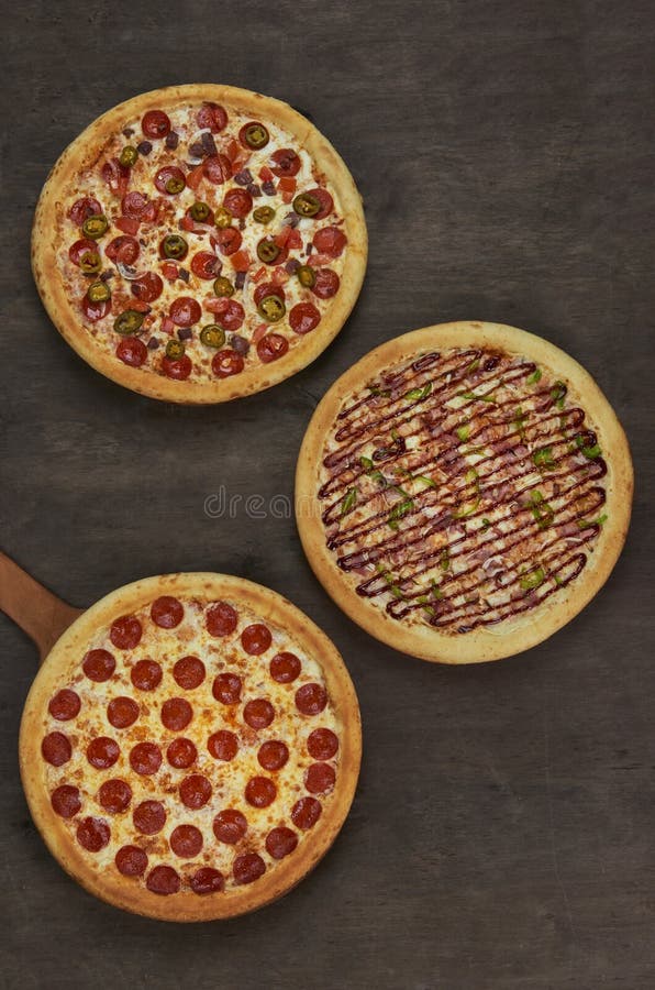 Three Pizzas on the Wooden Table, Top View Stock Image - Image of dark ...
