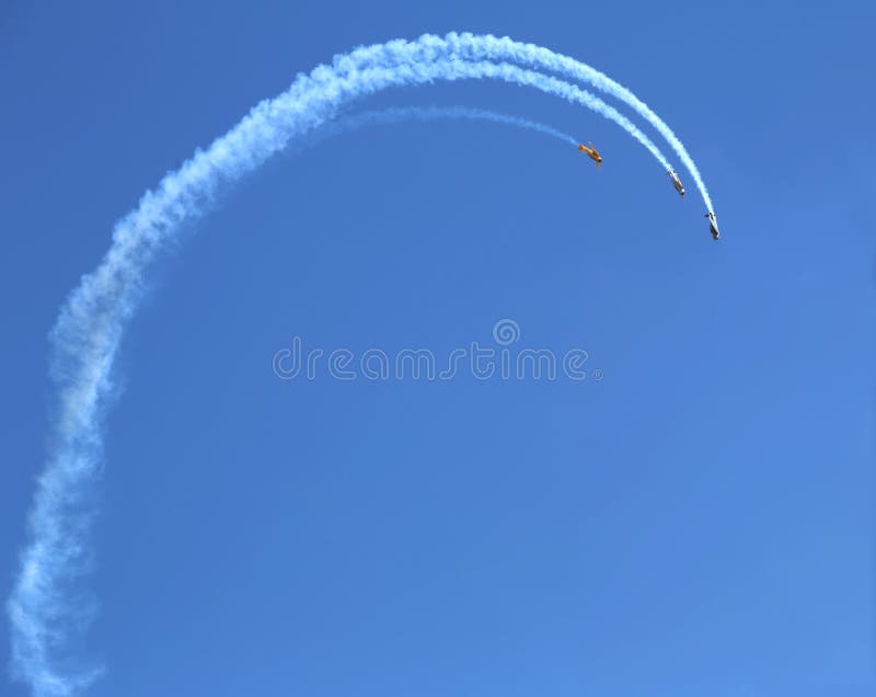 Three Planes Looping the Loop Stock Photo - Image of planes, blue ...
