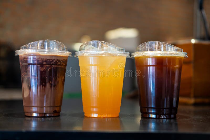 Three Plastic Cup of Iced Black Coffee, Iced Mocha and Iced Tea Stock ...