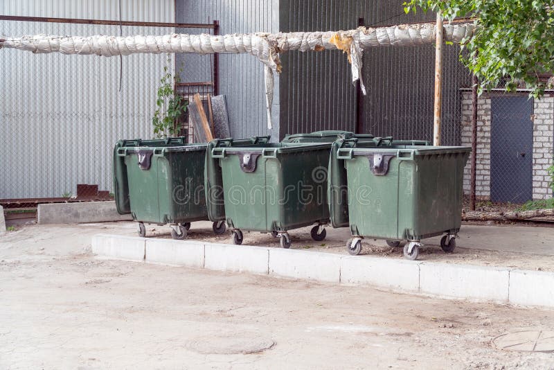 Three plastic garbage cans stock image. Image of environmental - 123222749