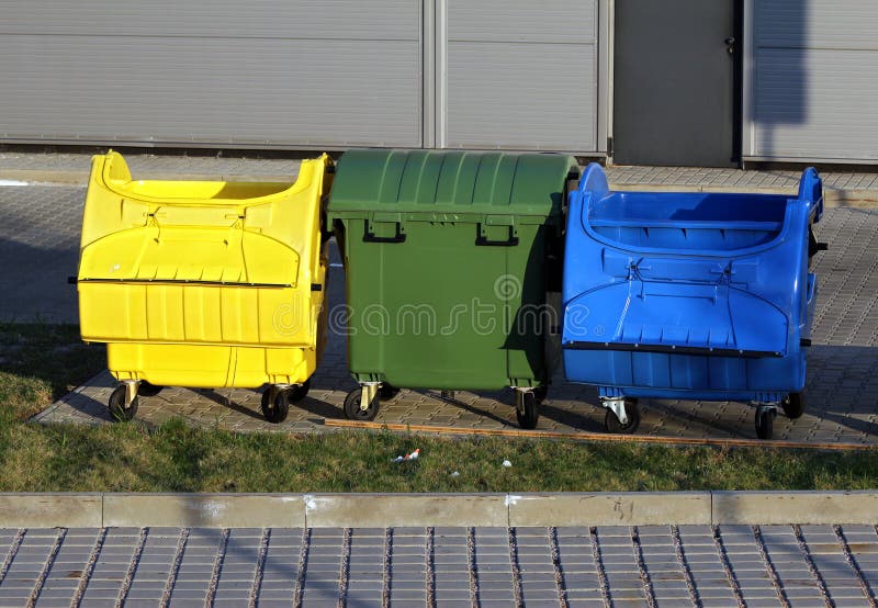 Three Plastic Trash Recycling Bins on the Street Stock Image - Image of ...