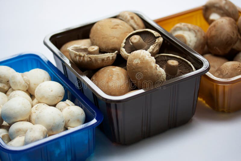 Three Plastic Trays of Assorted Raw Mushrooms Stock Photo - Image of ...