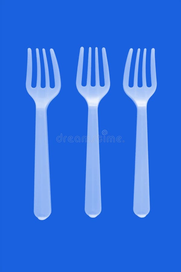Three Plastic White Forks on a Blue Background. Isolate. Top View ...