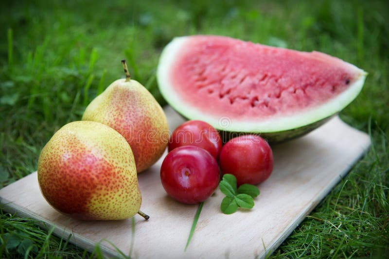 Three Plums with Pears and Watermelon Stock Image - Image of fruits ...