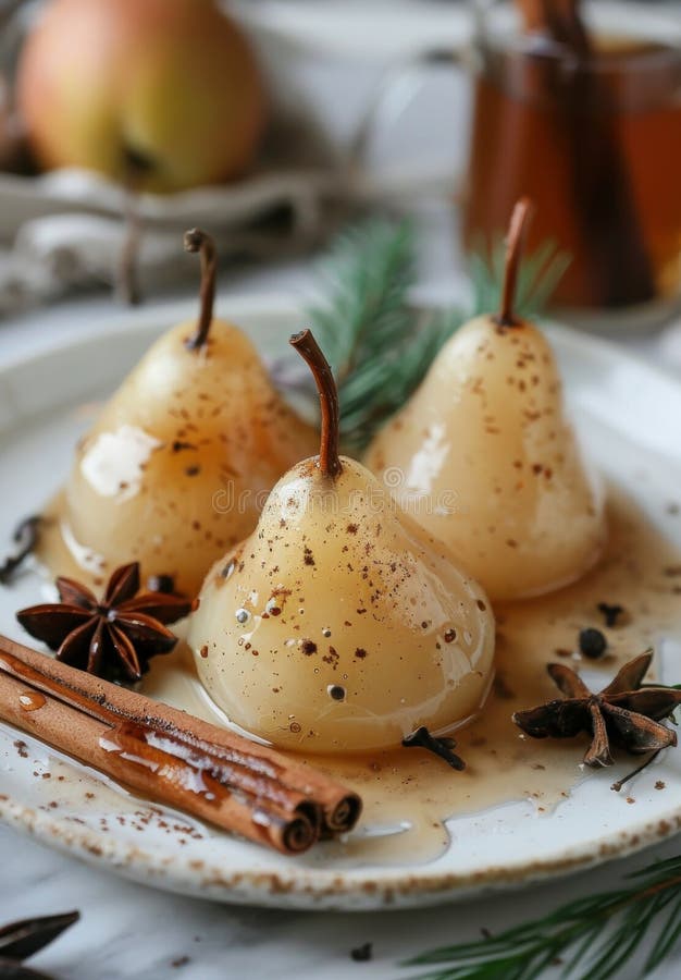 Three Poached Pears with Cinnamon and Star Anise on a White Plate Stock ...