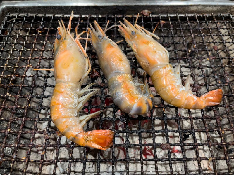 Three Prawns are Grilled on a Hot Charcoal Grill. Stock Photo - Image ...