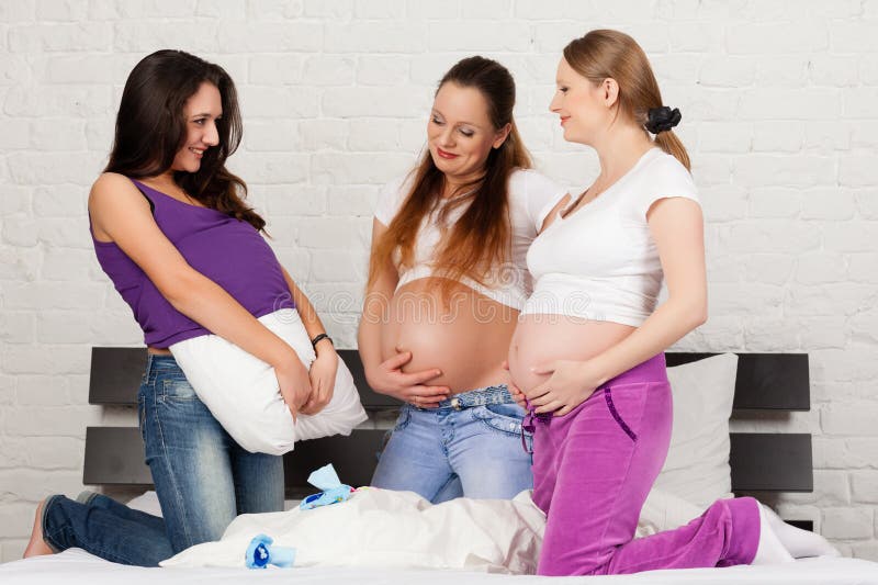 Three pregnant girlfriend stock photo. Image of belly - 24049922