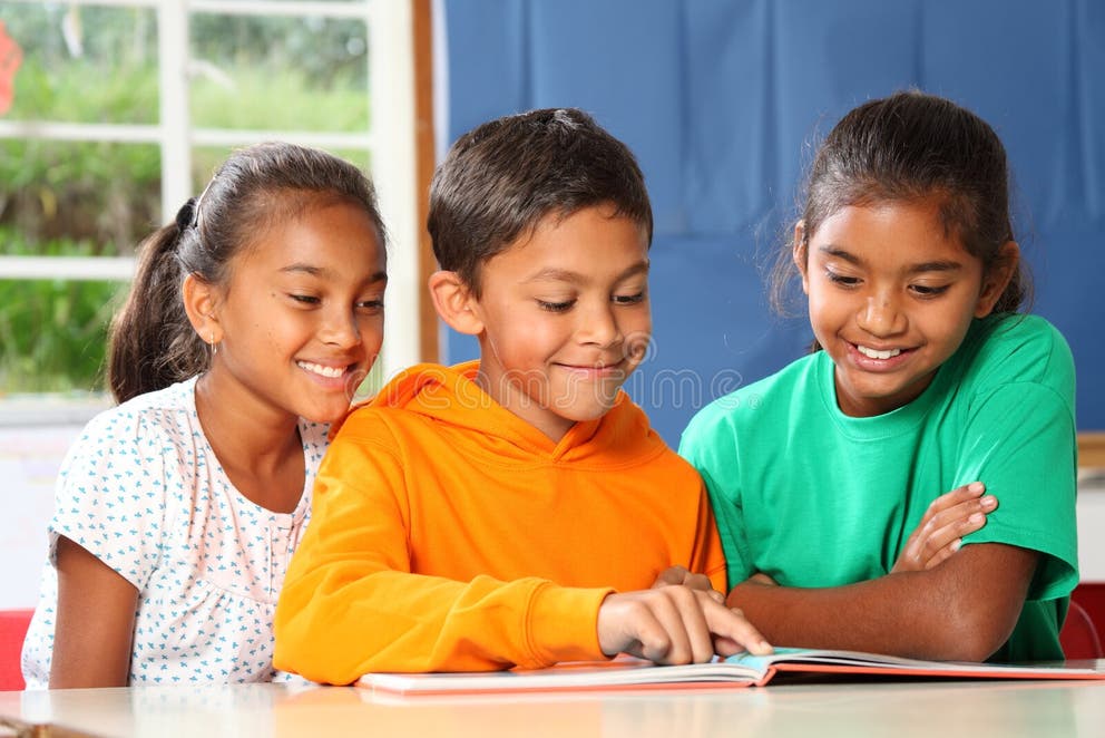 Three Primary School Children Reading and Learning Stock Photo - Image ...