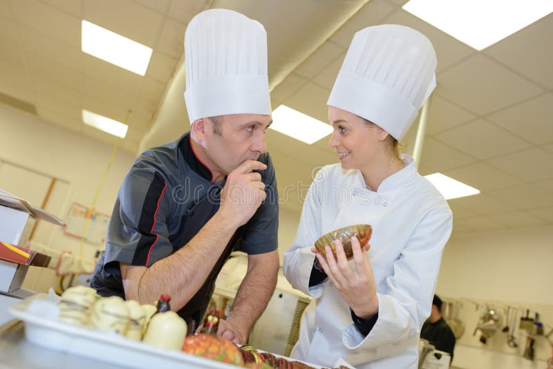 Three Professional Chefs Working in Commercial Kitchen Stock Image ...