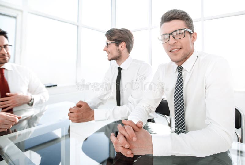 Three Professional Employees Sitting at the Office Table Stock Image ...