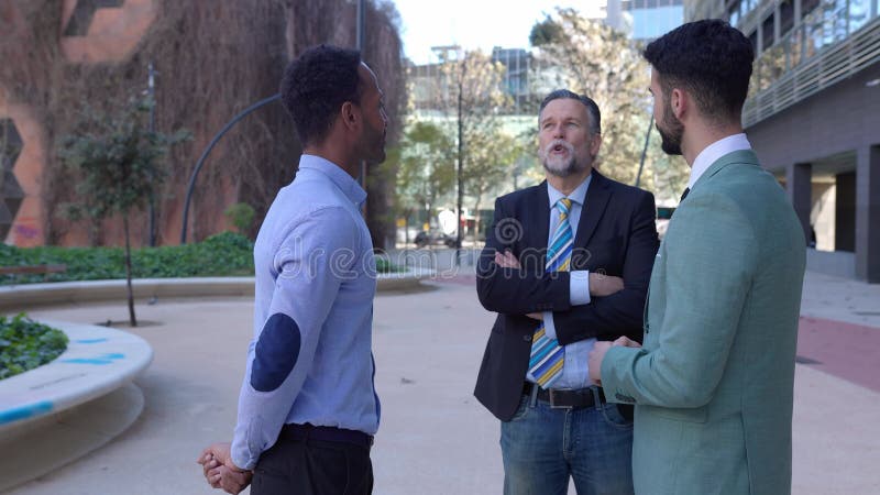 Three Professional Successful Business People Talking at Financial ...