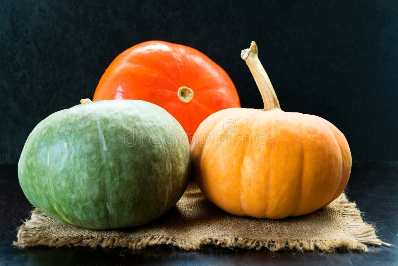 Pumpkins Of Different Colors And Shape Lie On The Hay. Autumn Harvest ...