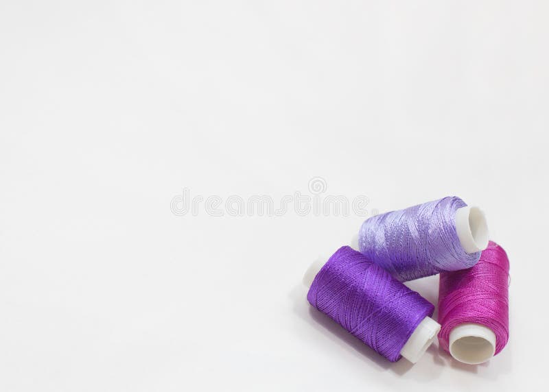 Three Purple Thread Spools on Cream Background with Copy Space Stock Photo - Image of surface ...