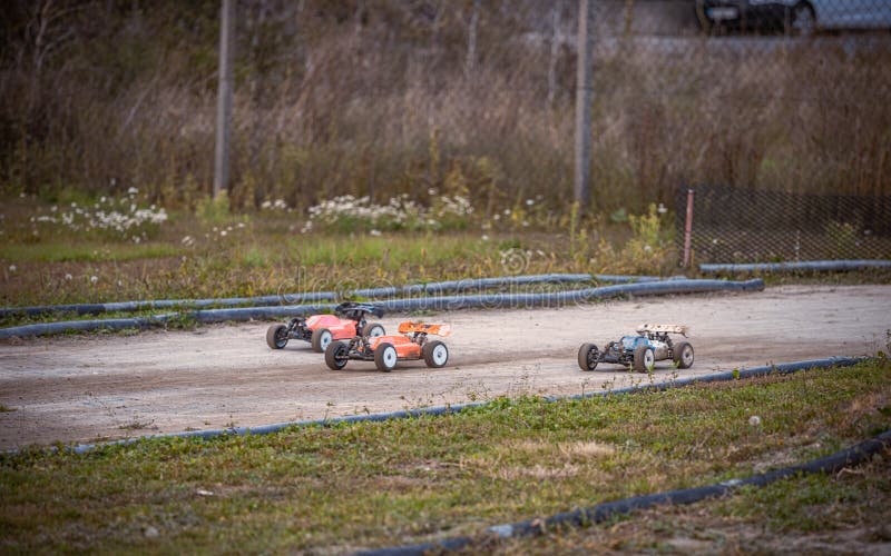 Three Offroad RC Cars Racing on a Track Stock Photo - Image of power ...