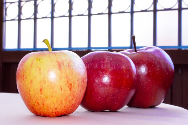 Three Apples in Line on the Table Stock Photo - Image of organic, sweet ...