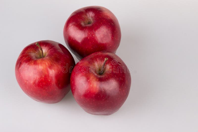 Three red apples on white stock image. Image of eating - 57944323