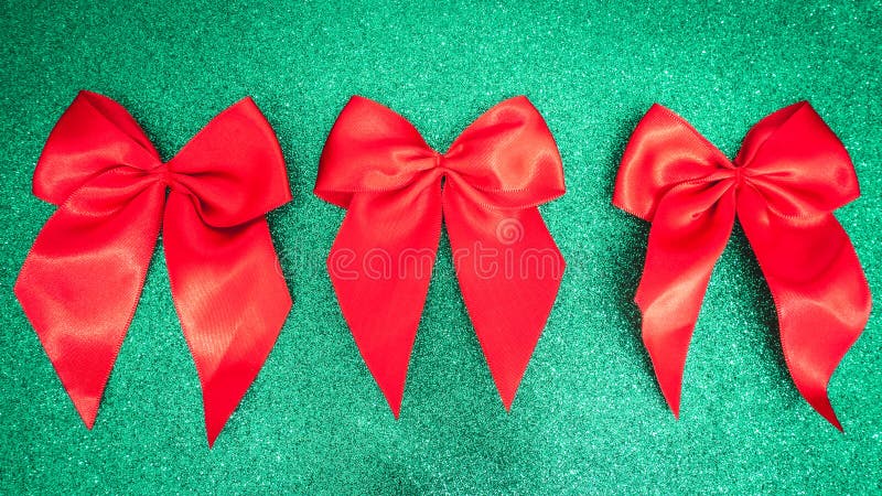 Three Red Bows on a Green Background. Stock Image - Image of paper ...