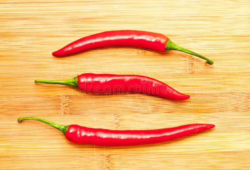 Three red chili peppers stock photo. Image of pepper - 31234066