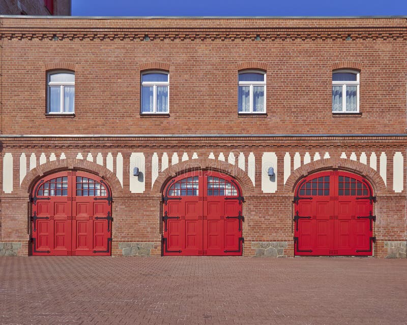 Red Fire Station Doors On Red Brick Wall Building Stock Photo - Image ...