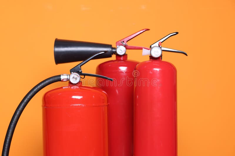 Three Red Fire Extinguishers in Hall. Space for Text Stock Photo ...