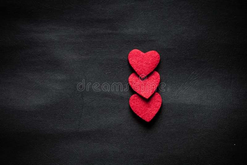 Three Red Hearts on Black Paper Stock Image - Image of belonging ...