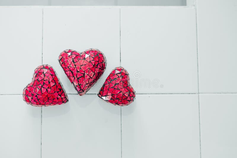 Three Red Hearts of Different Sizes on a White Background Stock Photo ...