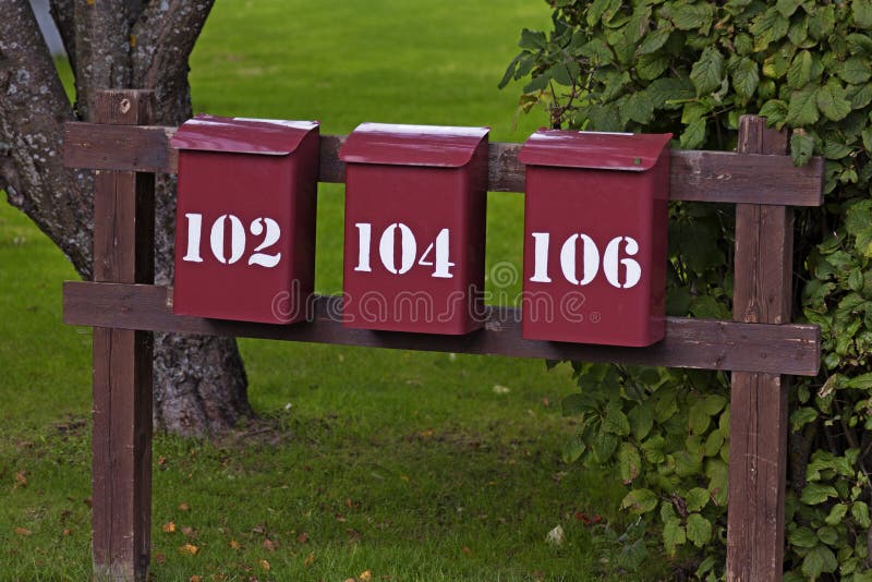 Three Red Mailboxes in a Row with White Text Stock Photo - Image of ...