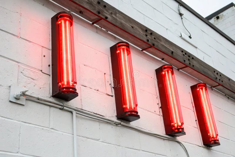 Three Red Neon Bulbs on White Wall Stock Illustration - Illustration of ...
