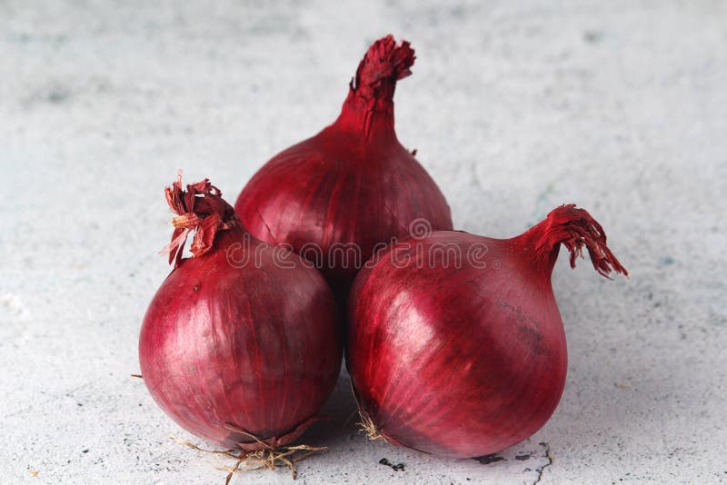 Three Red Onions on the Table Stock Photo - Image of three, natural ...