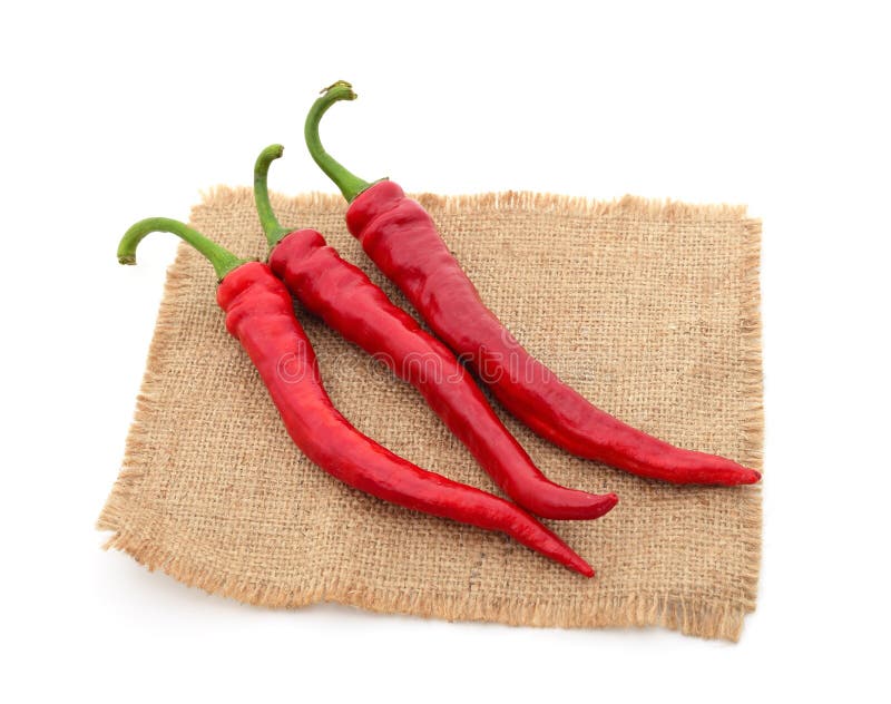Three red pepper on burlap stock photo. Image of meal - 252880836
